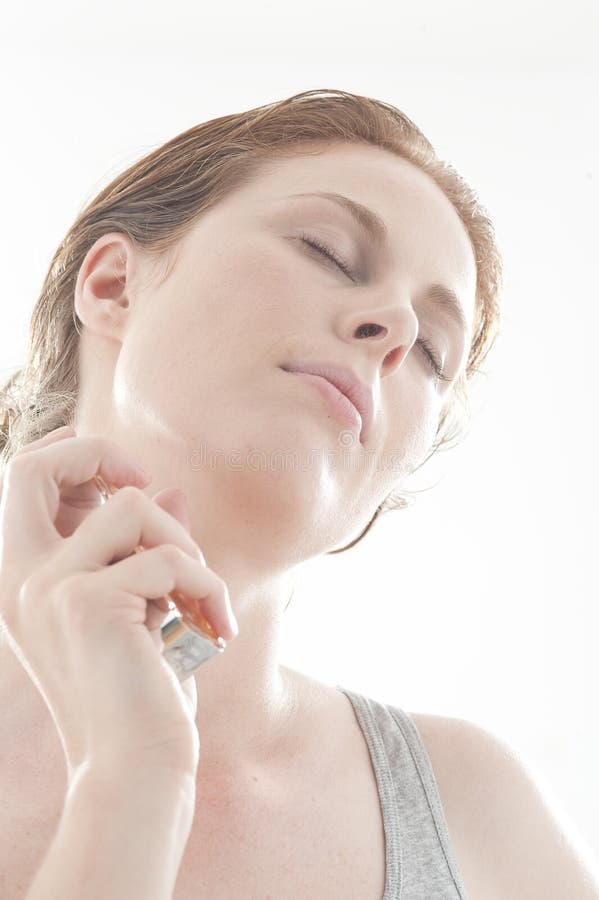 Woman spraying perfume stock image. Image of handing - 15453359