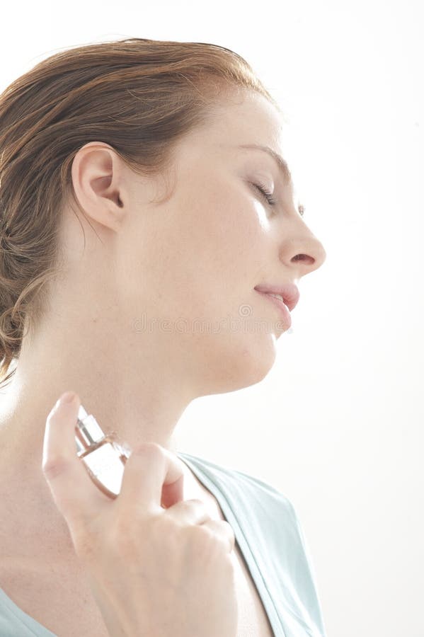 Woman spraying perfume stock image. Image of adult, beauty - 15453665