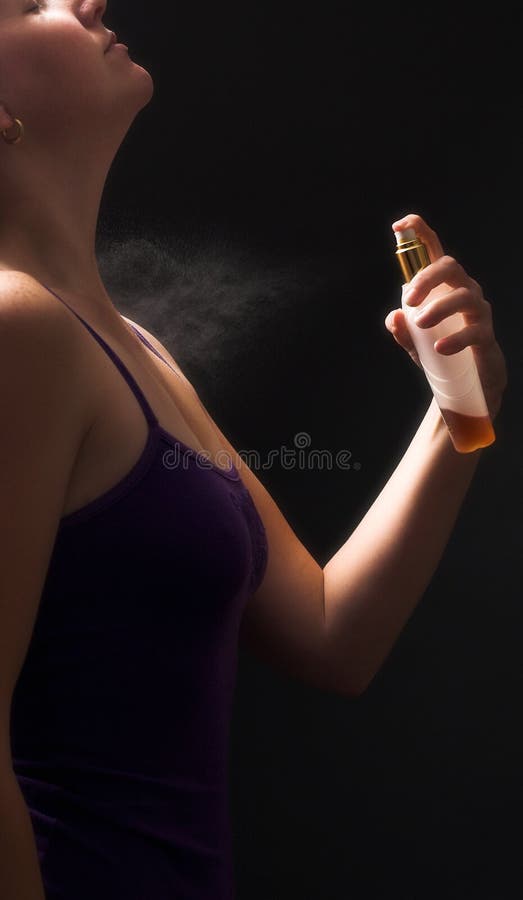 Woman spraying perfume stock photo. Image of perfume, singlet - 1774992