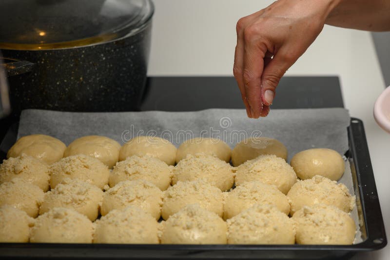 Woman Sprinkles Buns in the Kitchen 5 Stock Image - Image of cooking ...