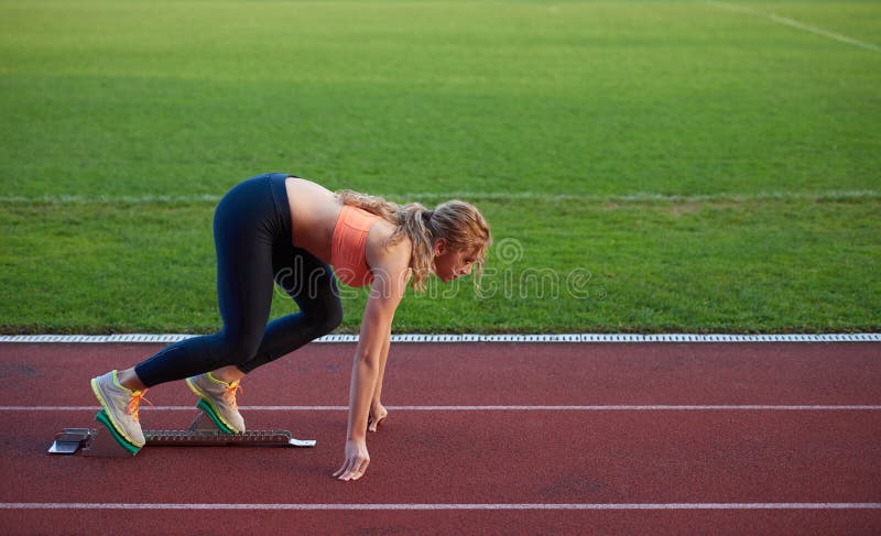 Woman Sprinter Leaving Starting Blocks Stock Image - Image of person ...