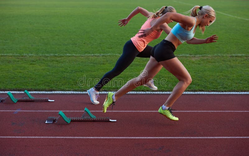 Woman Sprinter Leaving Starting Blocks Stock Image - Image of energy ...