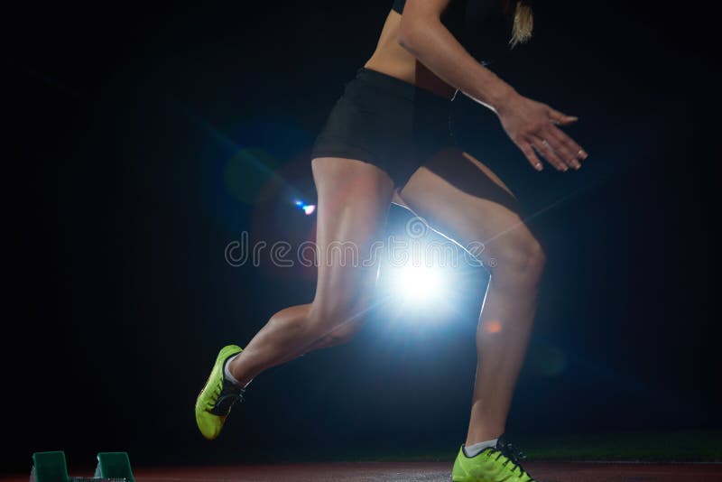 Woman Sprinter Leaving Starting Blocks Stock Photo - Image of health ...