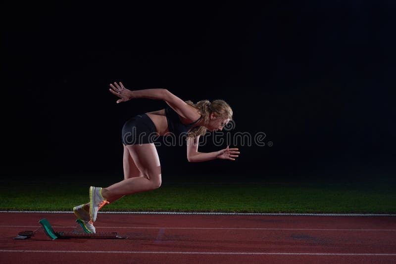Woman Sprinter Leaving Starting Blocks Stock Image - Image of athlete ...