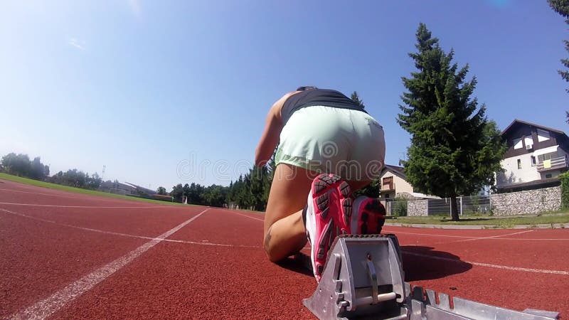 Woman Sprinter Starting from the Blocks Stock Video - Video of ...