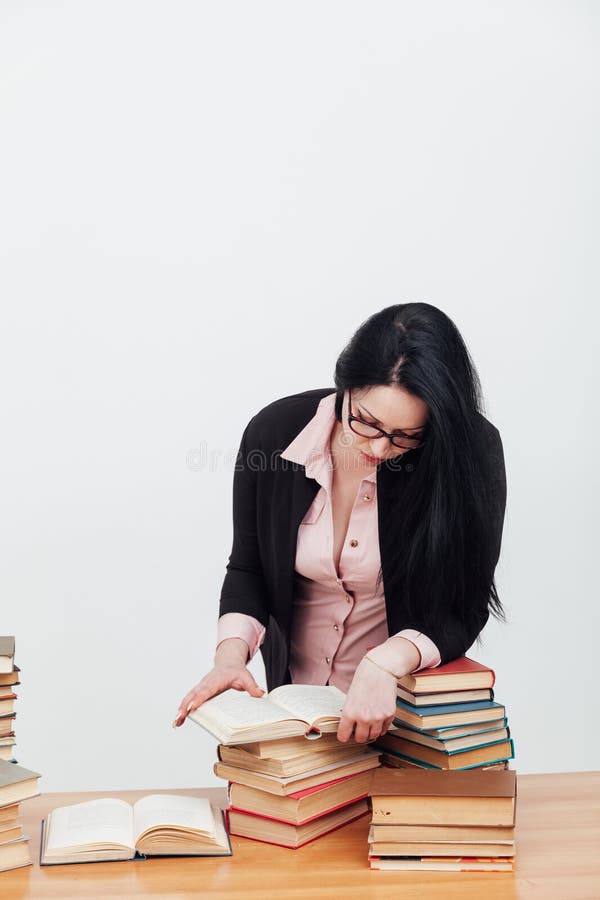 Woman with a Stack of Books in the Library Training Science Education ...