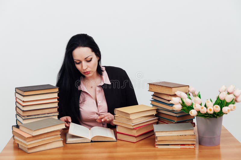 Woman with a Stack of Books in the Library Training Science Education ...