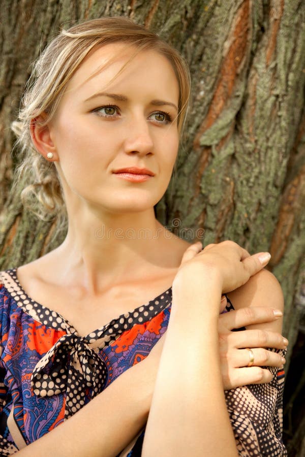 Woman Standing Against a Tree Stock Photo - Image of colorful, beauty ...