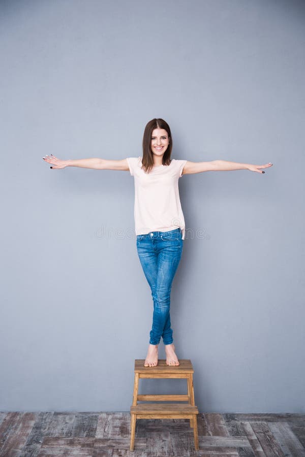 16,414 Woman Standing Chair Stock Photos - Free & Royalty-Free Stock ...