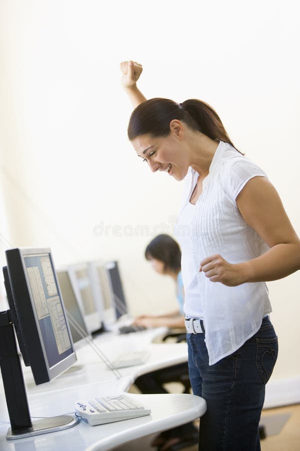 Woman Standing in Computer Room Cheering Stock Image - Image of smile ...
