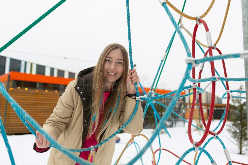Woman Standing in Front of Rope Structure Stock Photo - Image of ...