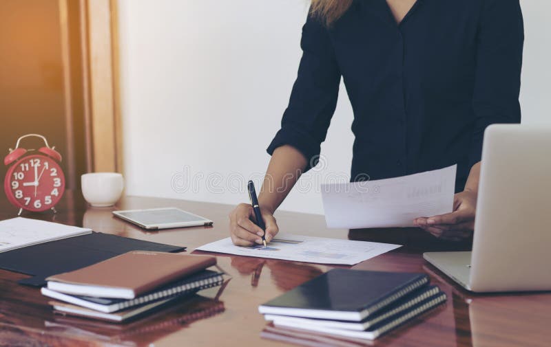 Woman Standing at Desk and Working Writing Document Stock Photo - Image ...