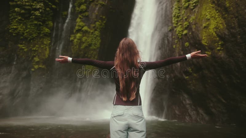 Woman Standing in Front of Bali Waterfall Stock Video - Video of ...