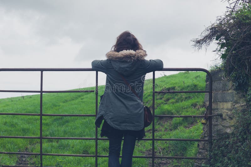 Woman Standing by Gate in Countryside Stock Image - Image of holiday ...