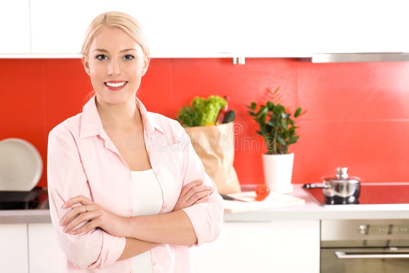 Woman standing in kitchen stock image. Image of happiness - 8883255