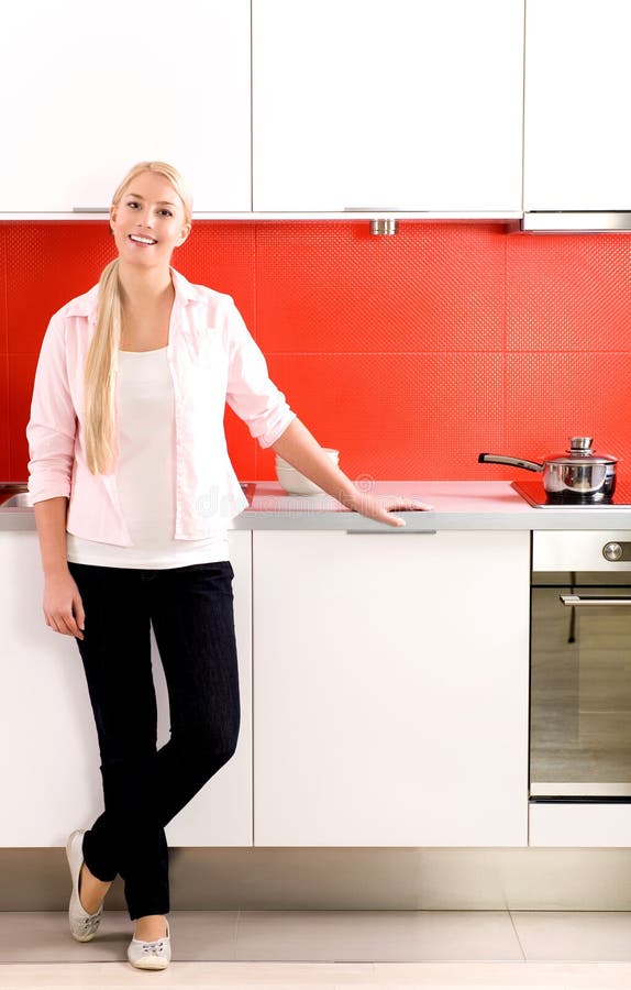 Woman Standing in the Kitchen Stock Image - Image of adult, interior ...