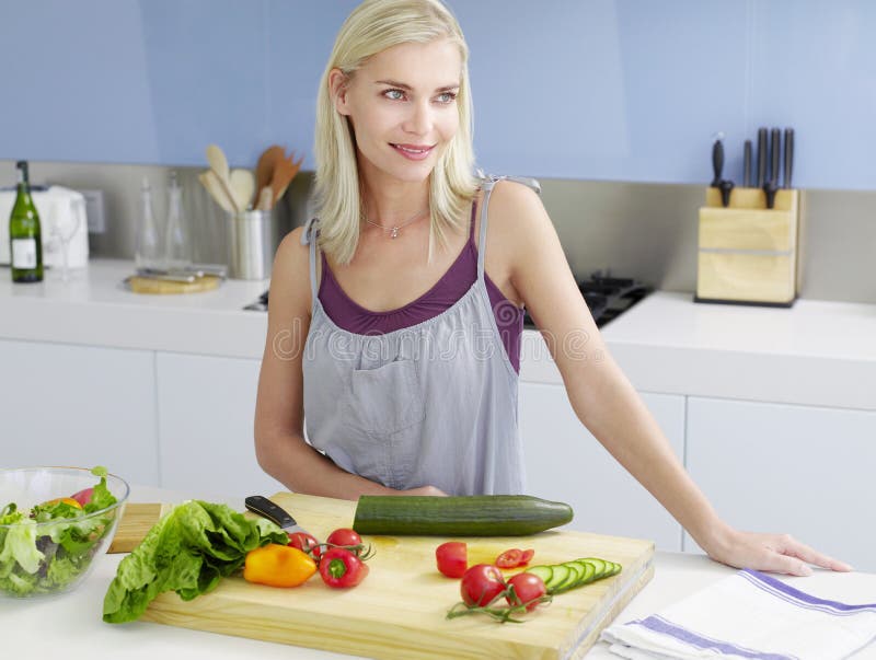 Woman Standing at Kitchen Counter Stock Photo - Image of napkin, home ...
