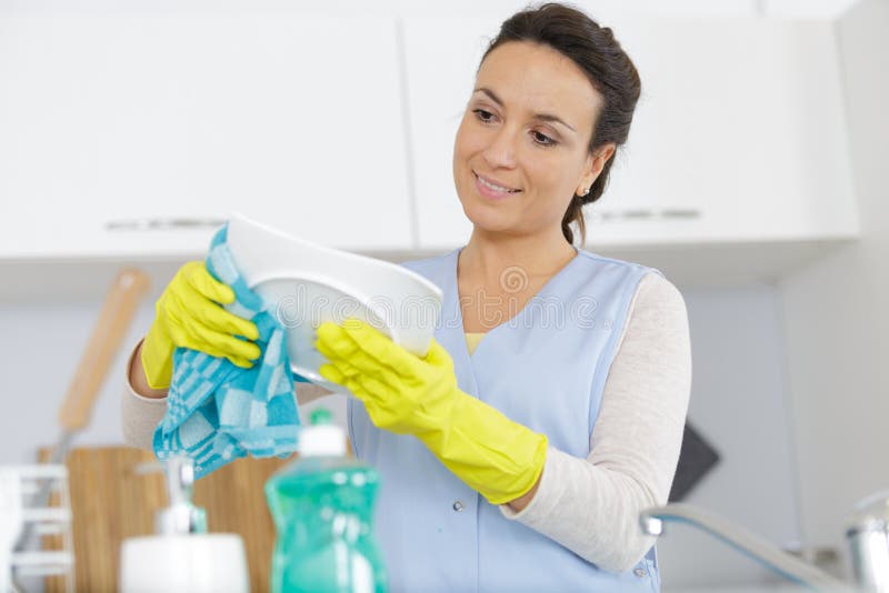 Woman Standing at Kitchen Sink Washing Up Stock Image - Image of ...