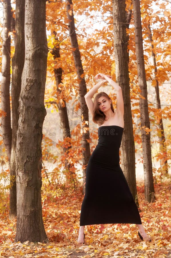 Woman standing near a tree stock image. Image of woman - 40623749