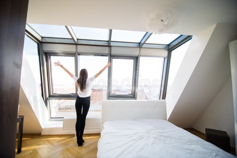 Woman Standing Near the Window Stock Image - Image of bedding, focus ...
