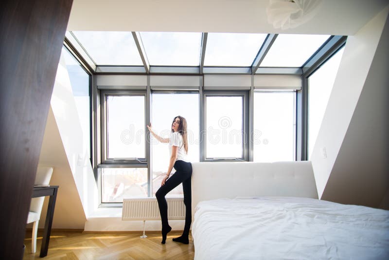 Woman Standing Near the Window Stock Image - Image of peignoir, lying ...