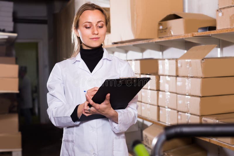 Woman Standing with Notepad in Production Workshop Stock Image - Image ...