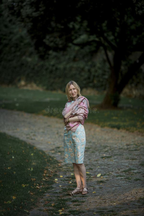 A Woman is Standing on a Path in a Park. Stock Image - Image of person ...
