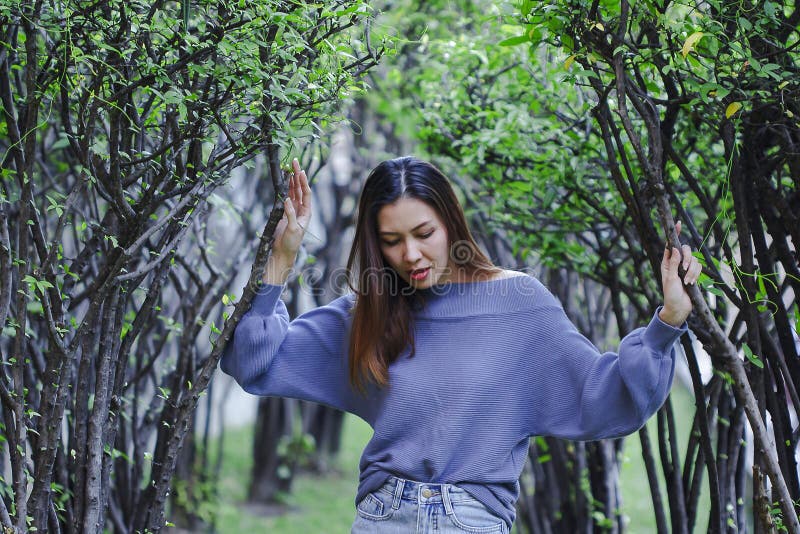 Woman Standing Under the Tree Stock Image - Image of fall, grass: 135624767