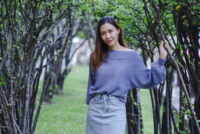 Woman Standing Under the Tree Stock Image - Image of attractive, adult ...