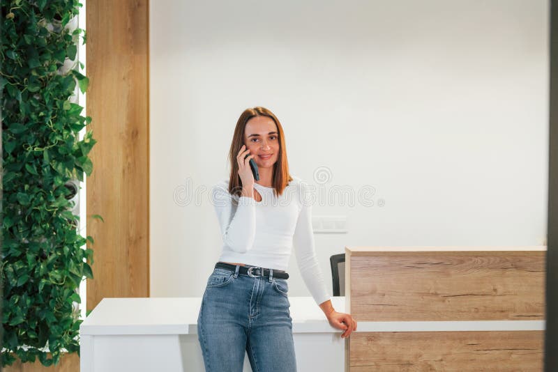 Woman Standing at the Reception in the Studio Stock Photo - Image of ...