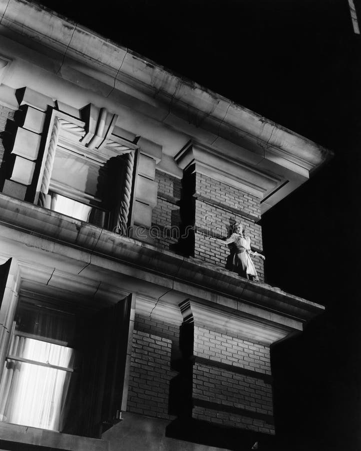 Woman Standing on the Top of a Building on a Ledge Stock Image - Image ...