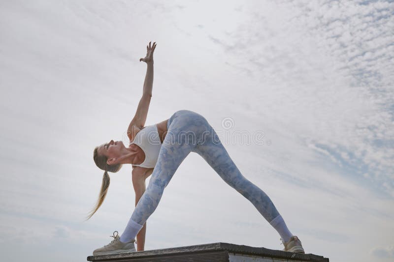 Woman Standing in Triangle Pose Stock Photo - Image of hobby, athletic ...