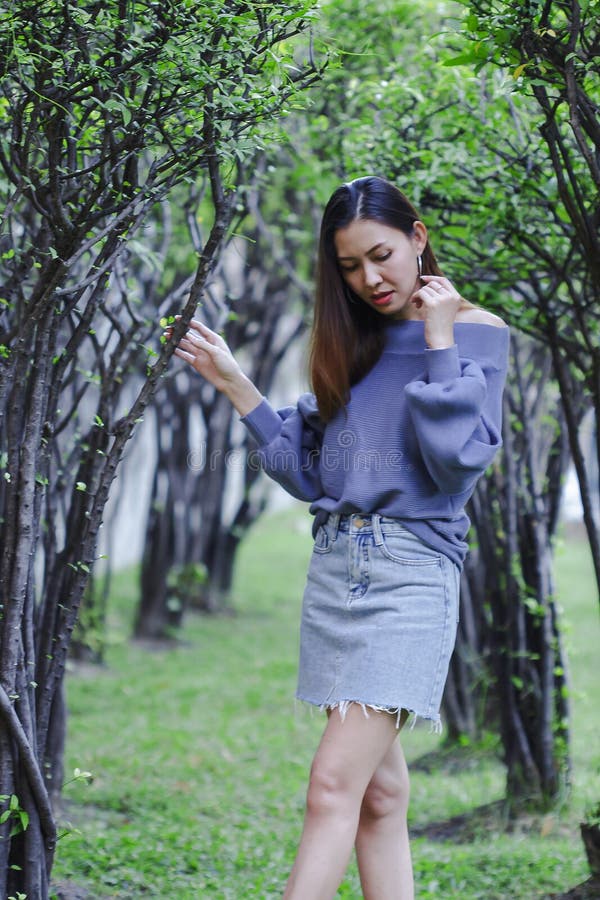 Woman Standing Under the Tree Stock Image - Image of happy, attractive ...