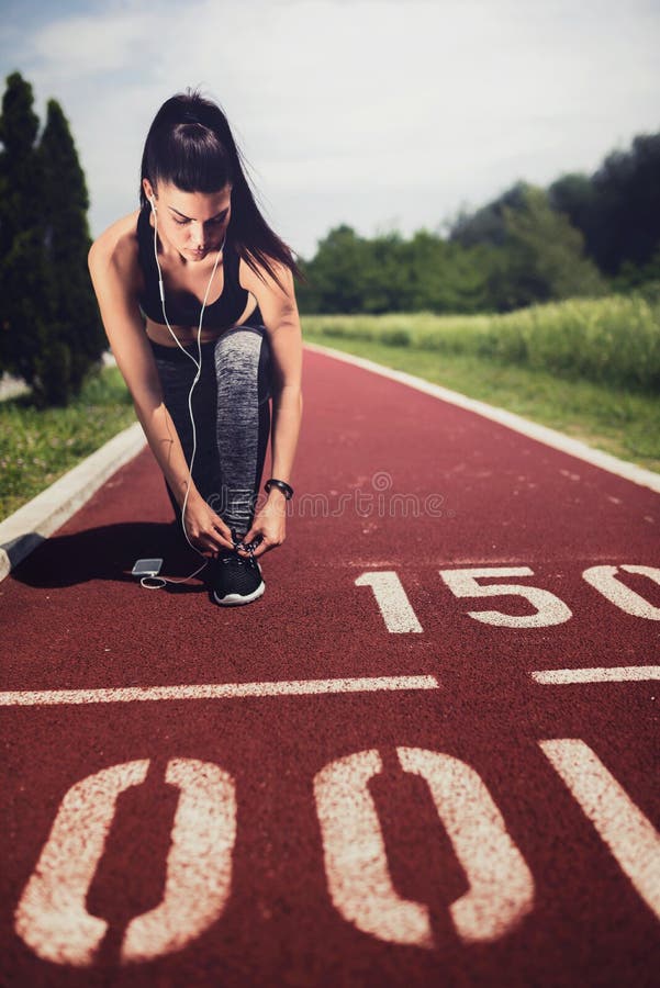 Woman at Start Line Ready To Run Stock Image - Image of preparing ...