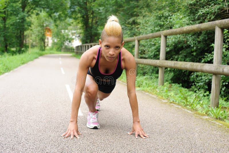 Woman in Start Position Preparing To Run Stock Photo - Image of sport ...