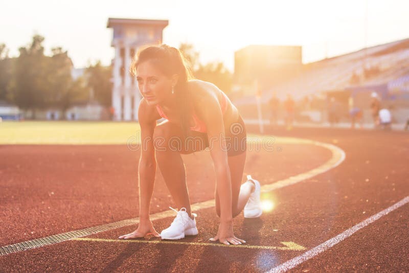Woman in Starting Position Ready for Running in Stadium. Stock Image ...