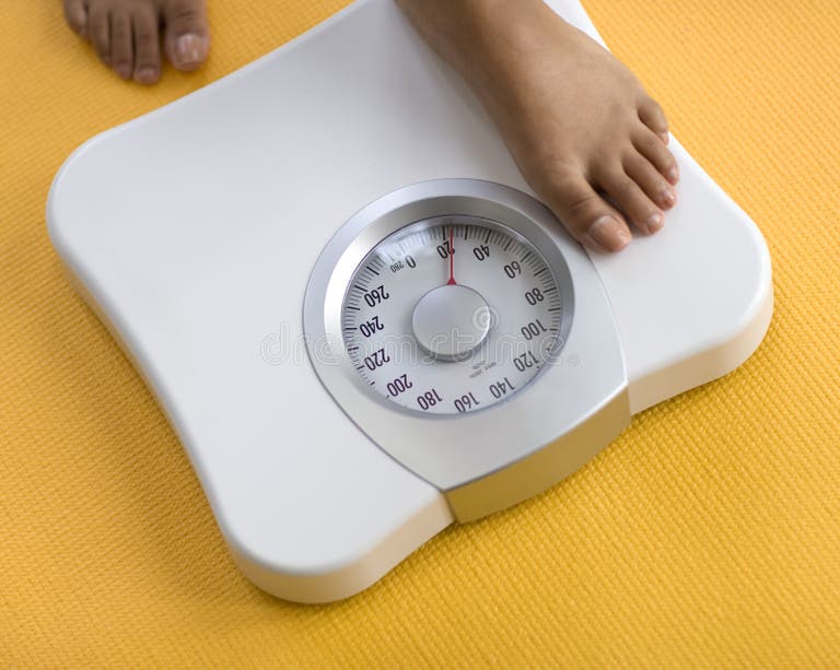 Woman stepping on scale stock photo. Image of step, feet - 4743750