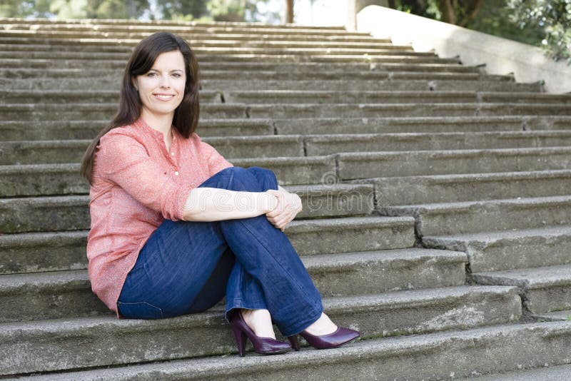 Woman on Steps stock image. Image of jeans, nature, person - 13690083
