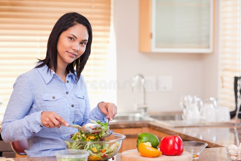 Woman Stirring Her Salad in the Kitchen Stock Image - Image of ...