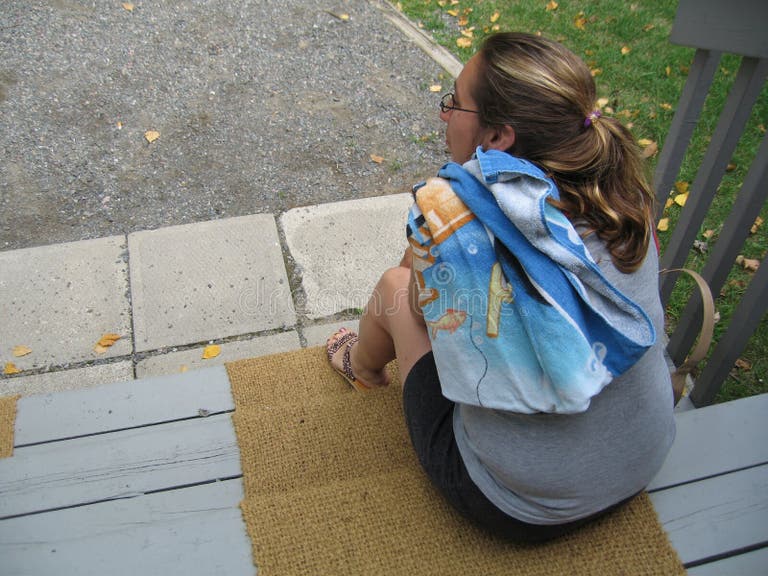 Woman on a Stoop stock image. Image of seated, ponytail - 389359