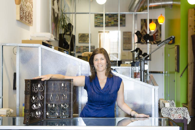 Woman at Store Counter stock photo. Image of portrait - 14687890