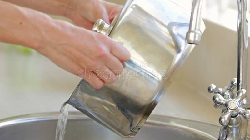 Woman Straining Pot of Water into the Sink Stock Footage - Video of ...