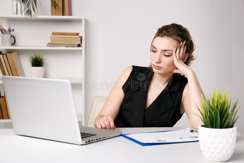 Woman in Stress Working on the Computer Sitting at a Desk in Office ...