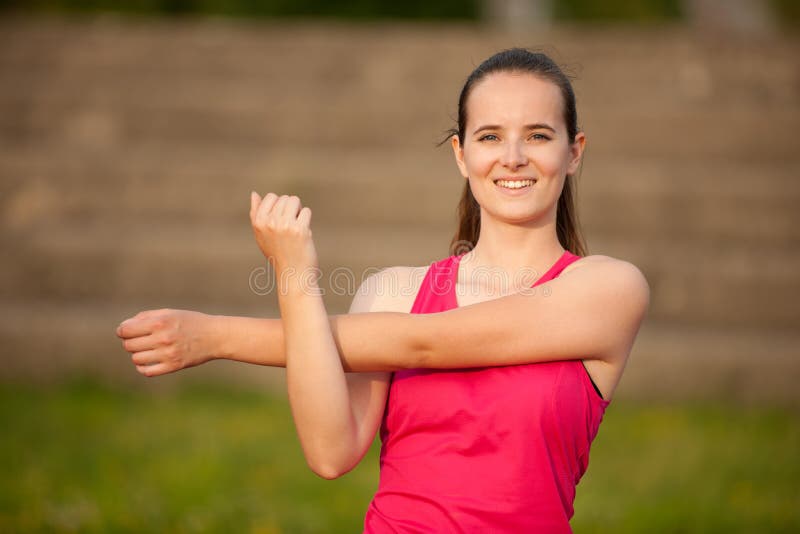 Woman Stretch Arms on Athletic Track Stock Image - Image of stretch ...