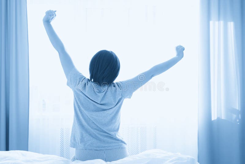 Woman Stretching in Bed after Wake Up, Back View Stock Photo - Image of ...