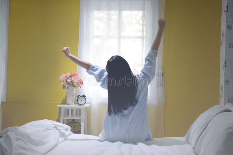 Back View of Well Rested Young Asian Woman Waking Up after Sleeping ...