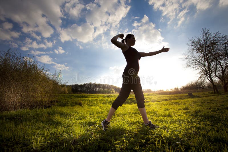 Woman Stretching Out on the Field Stock Image - Image of looking, hike ...