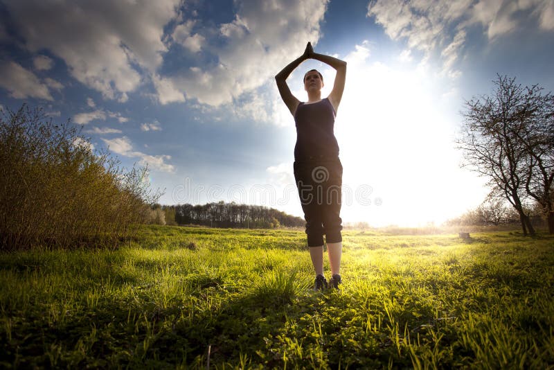 Woman Stretching Out on the Field Stock Photo - Image of activity ...