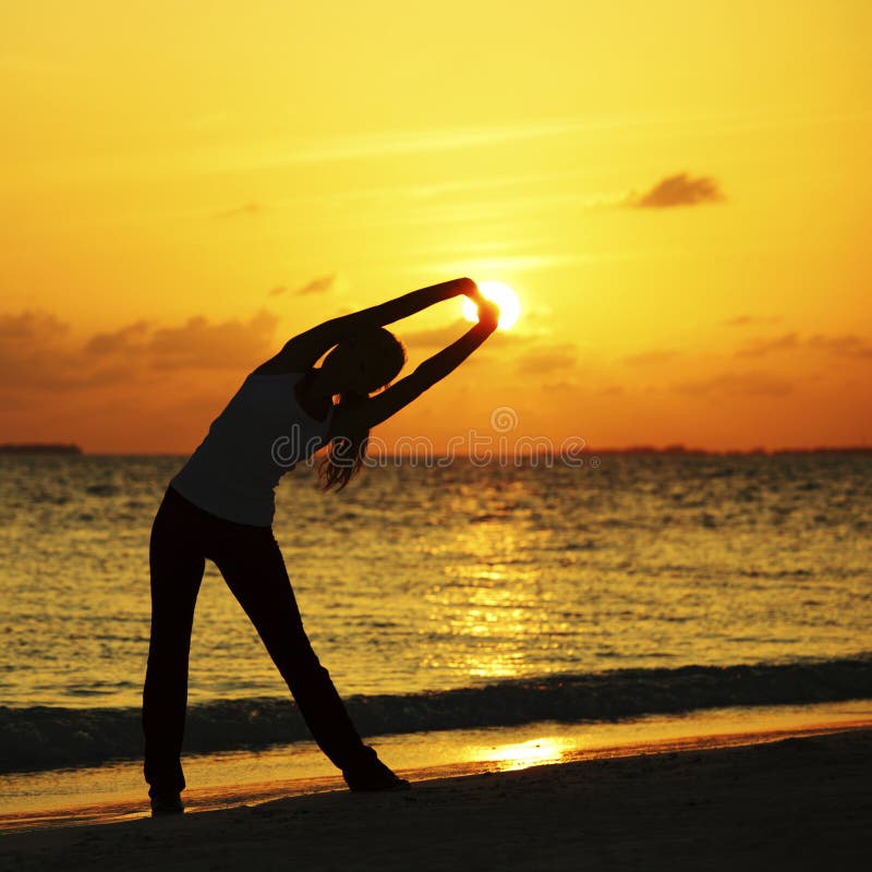 Stretching Exercises on Beach at Sunset Stock Image - Image of person ...