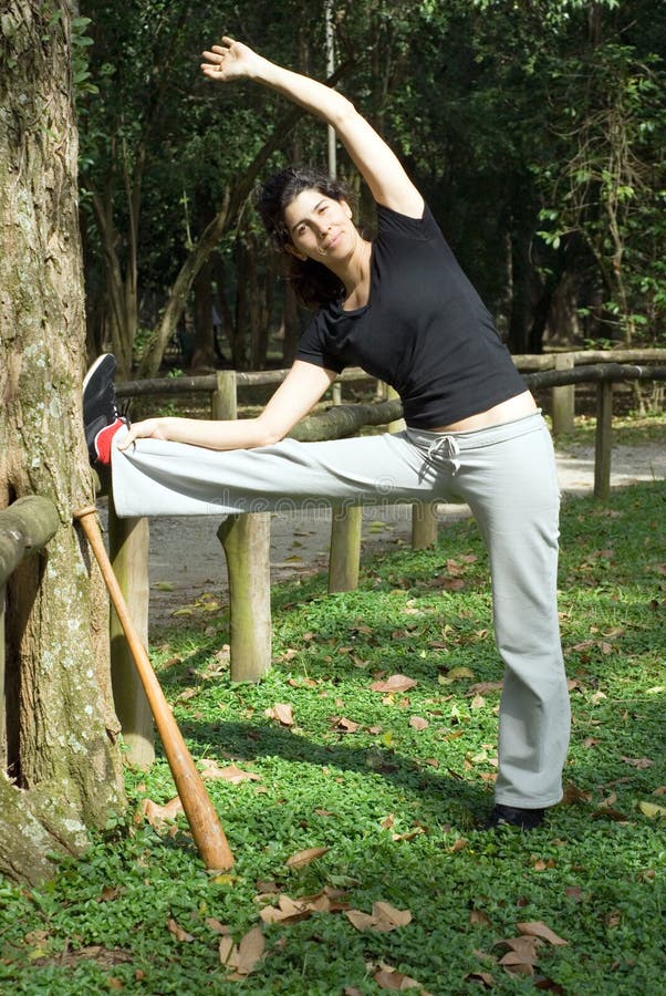 Woman Stretching by a Tree - Vertica Stock Image - Image of mixed ...
